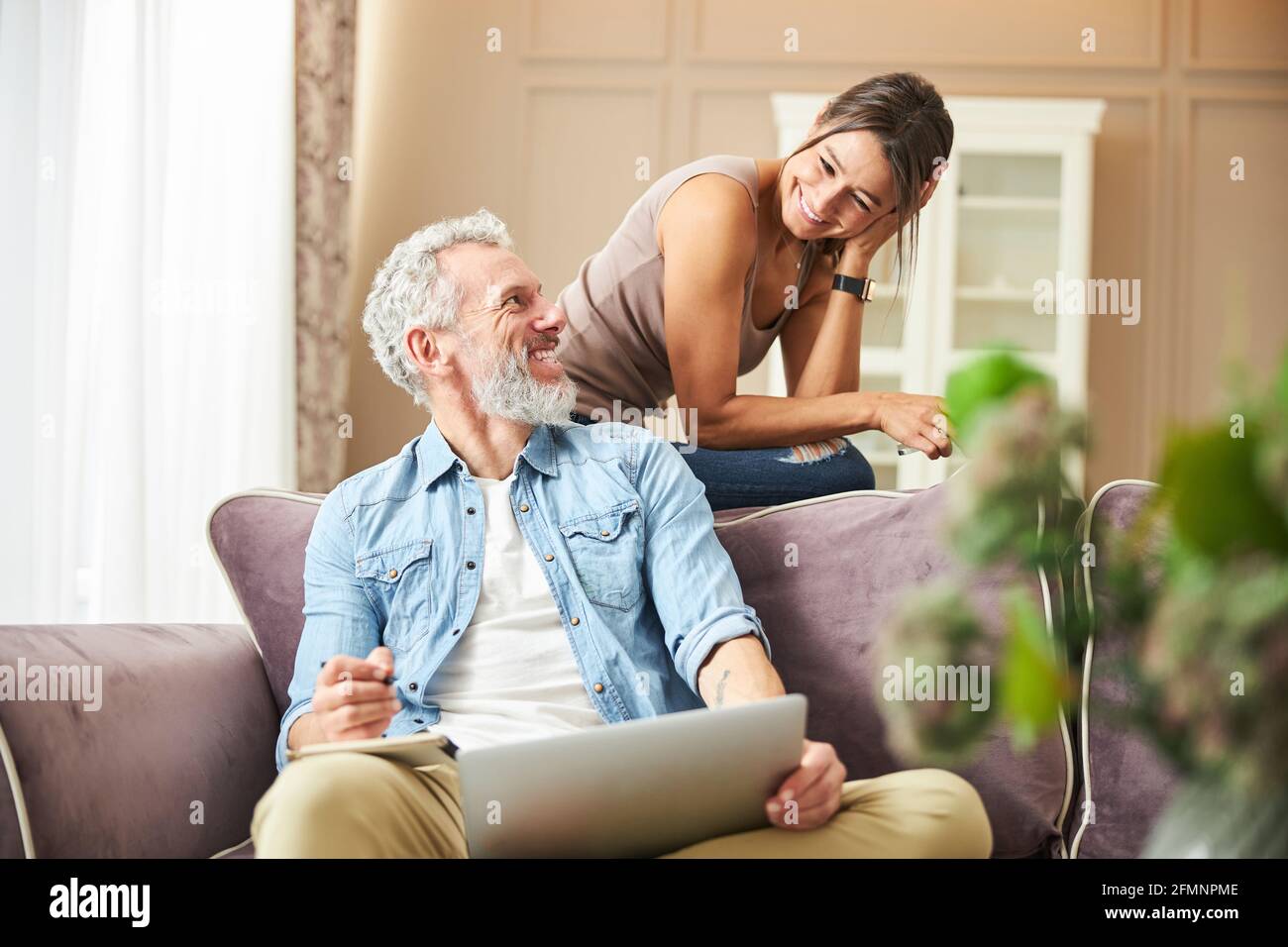 Positive delighted female person talking to her man Stock Photo - Alamy