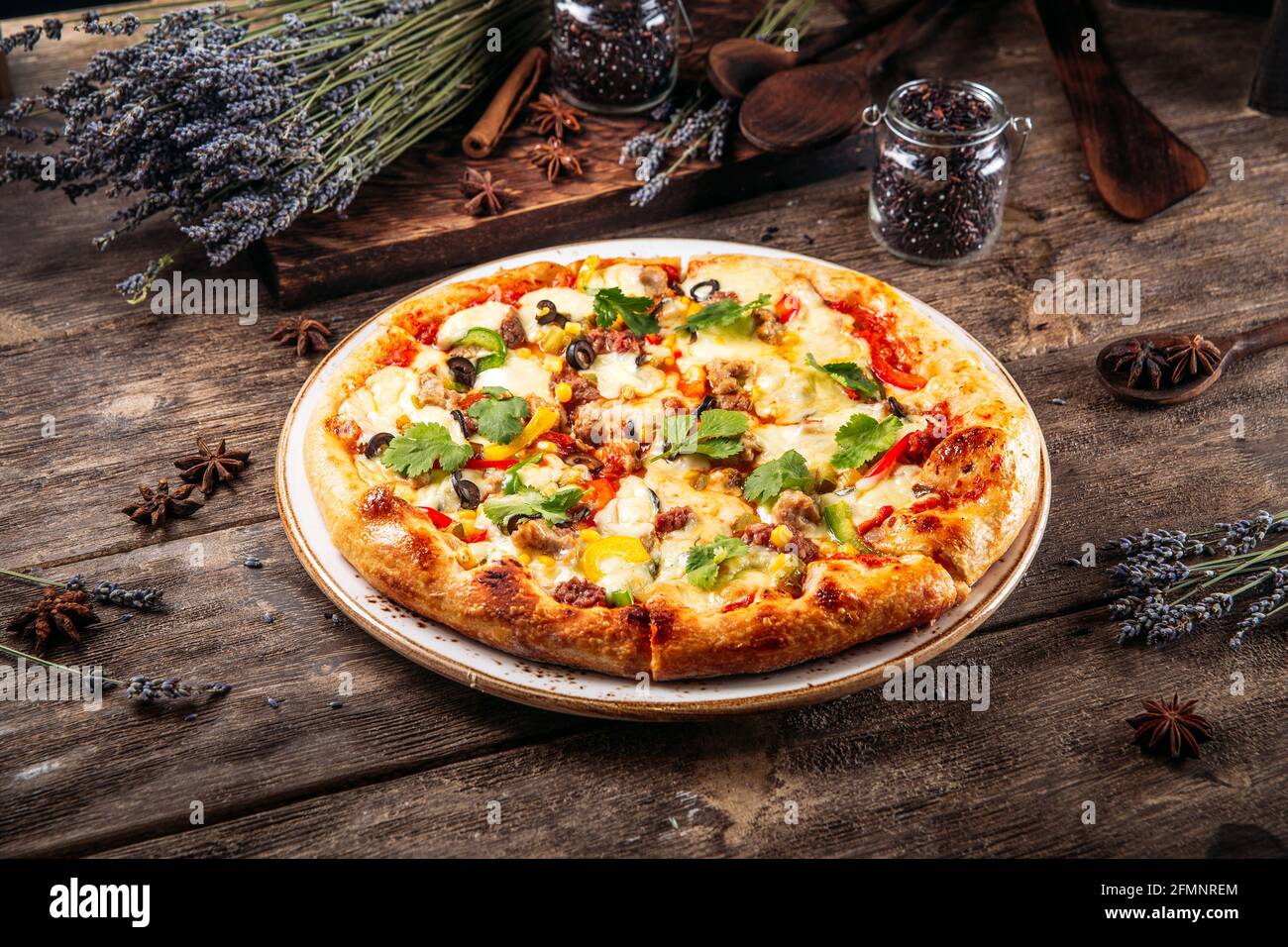 Appetizing fresh pizza with beef and olives Stock Photo - Alamy