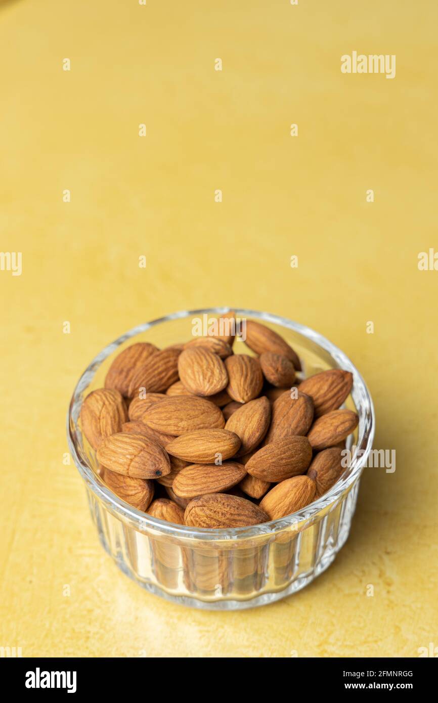Pile of peeled raw almonds in a bowl Stock Photo - Alamy