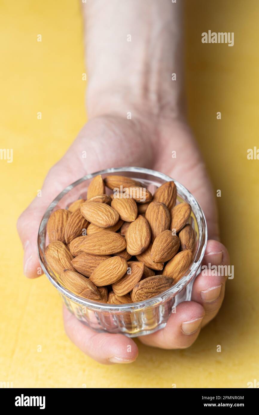 Hand full of almond hi-res stock photography and images - Alamy
