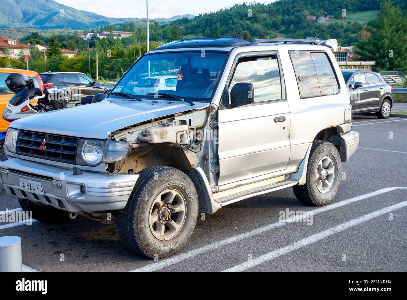 Car with damaged alloy wheels hi-res stock photography and images - Alamy