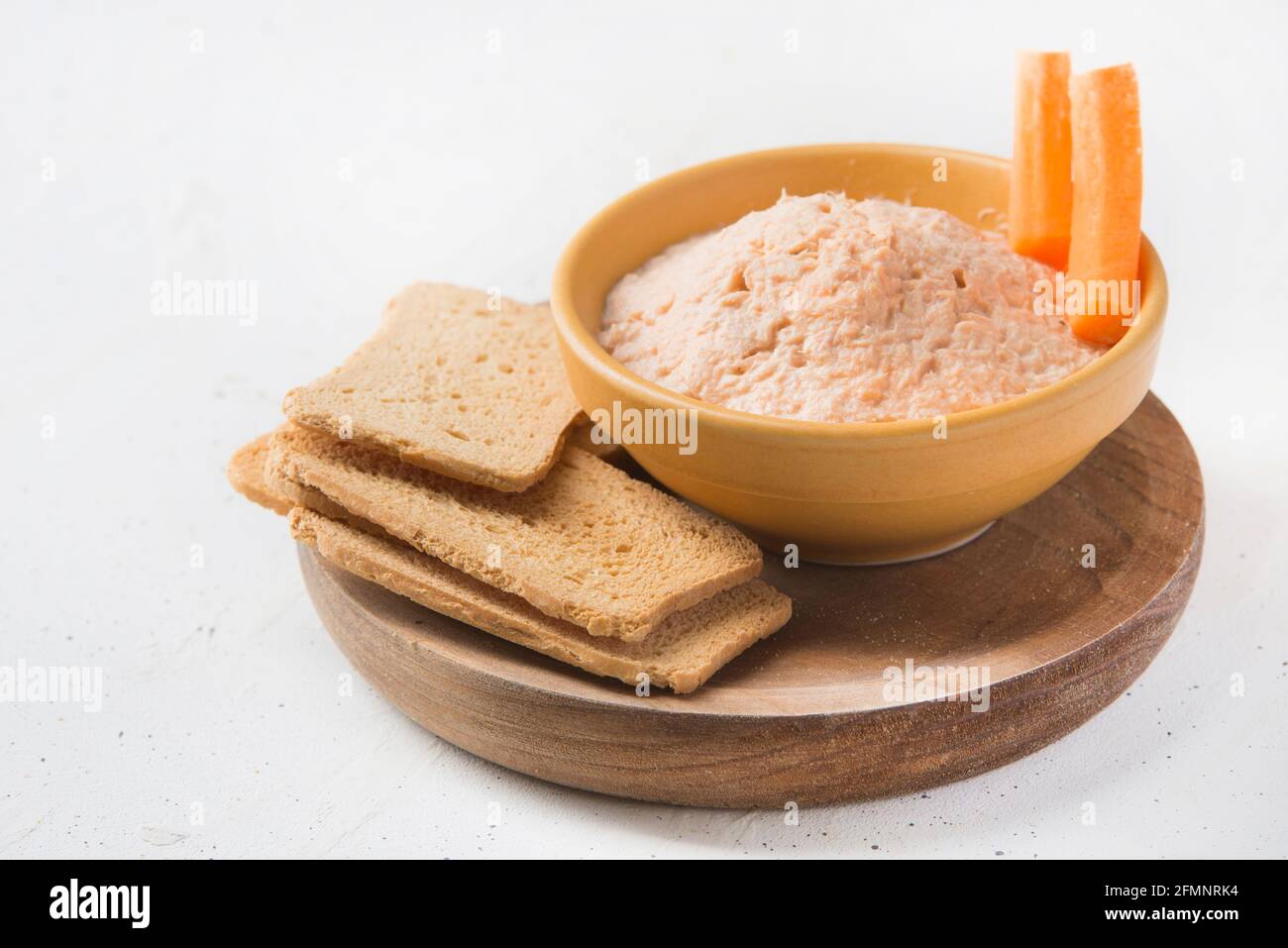 Smoked salmon and soft cheese spread pate with brown bread and carrot ...