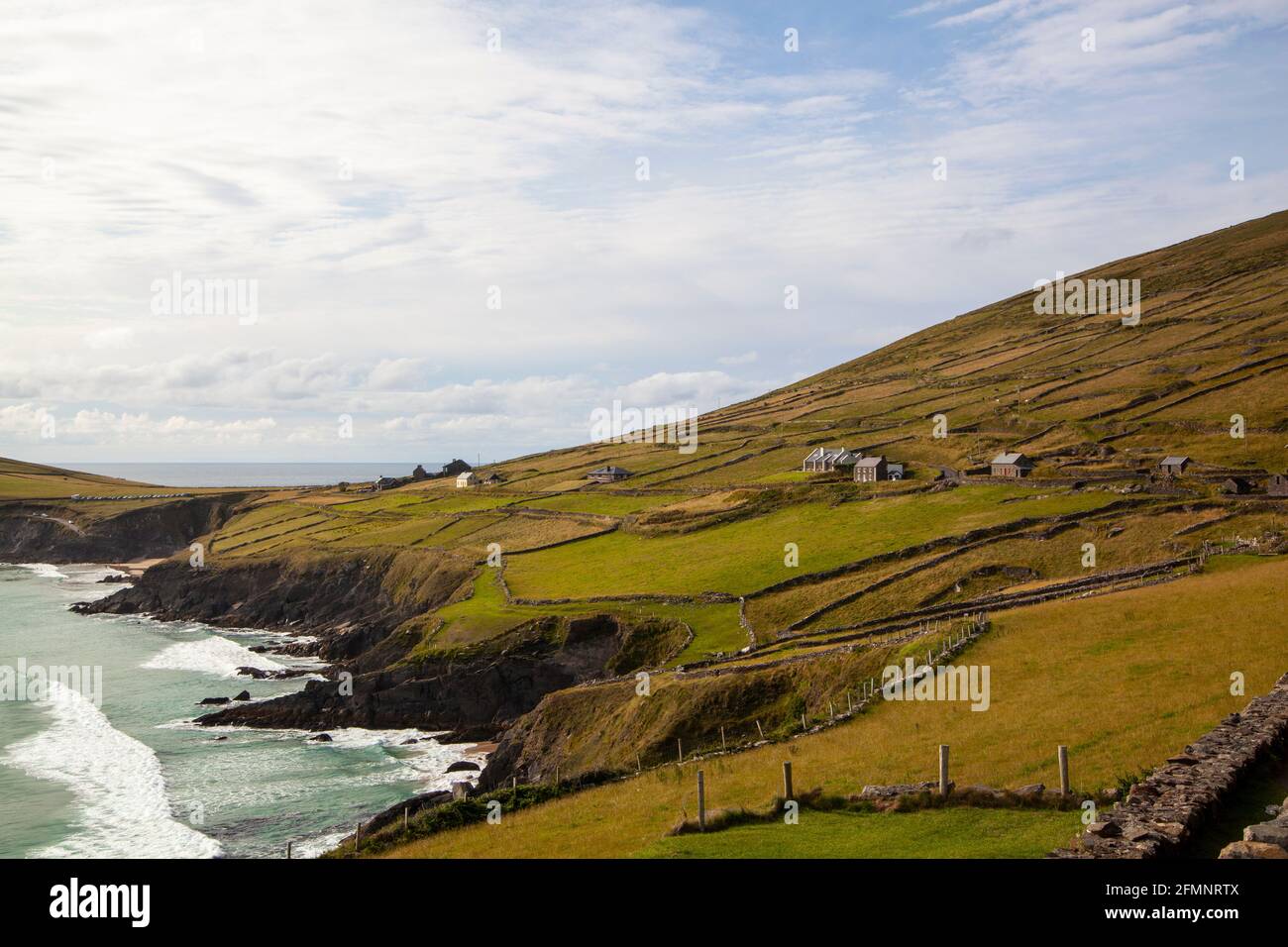 A view to a beautiful small village Coumeenoole next to Dunmore head in ...