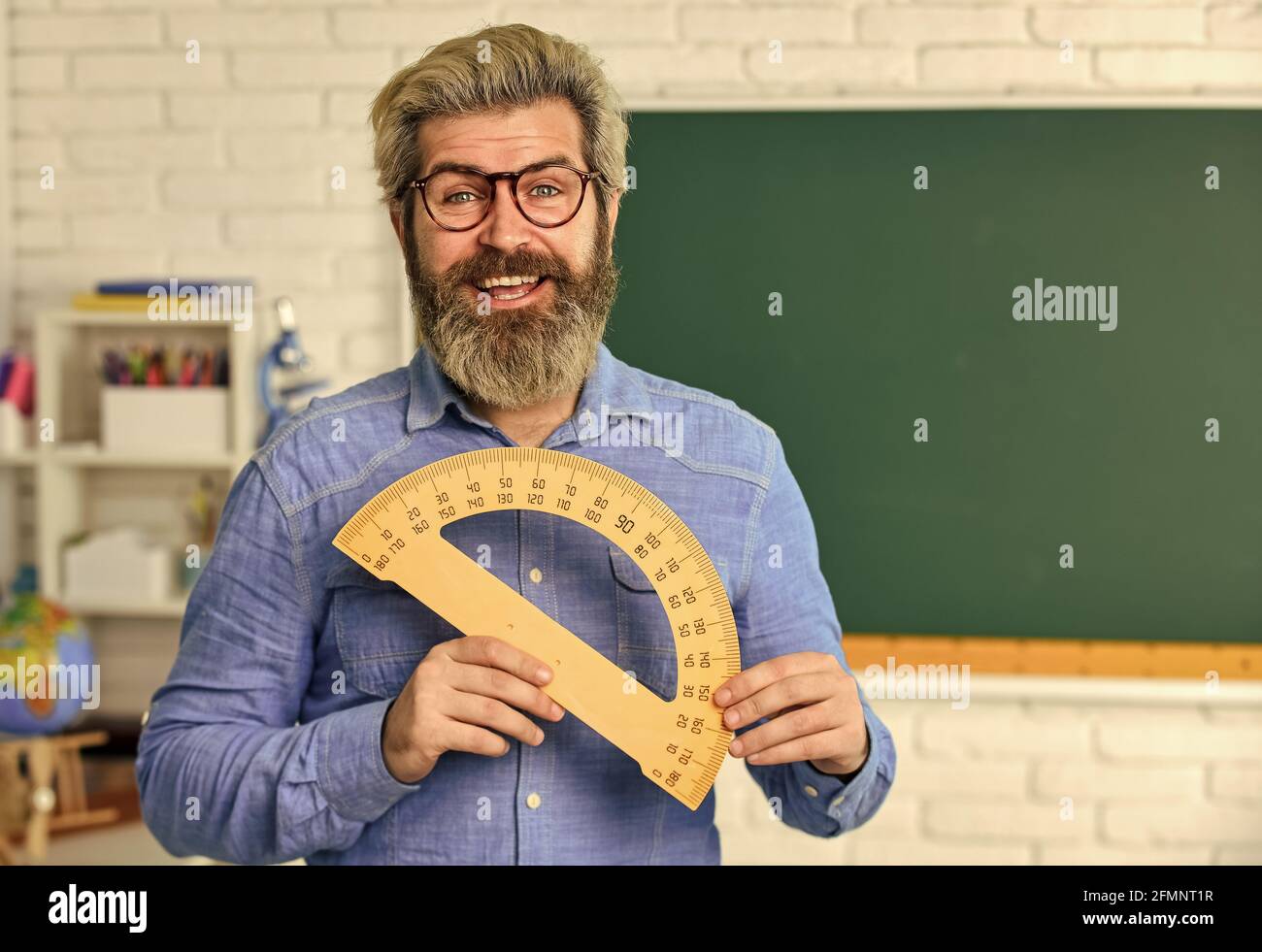 Math subject. Study mathematics. Man teacher mentoring school projects ...