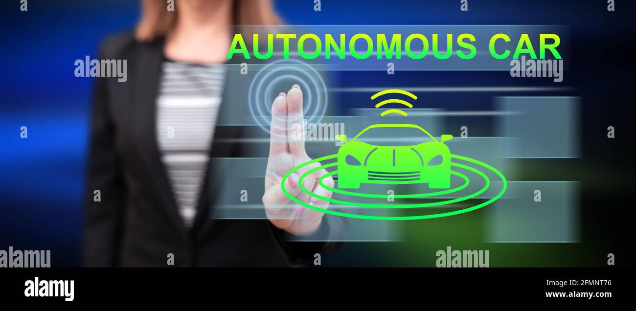 Woman touching an autonomous car concept on a touch screen with her ...