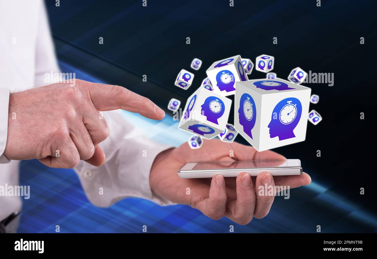 Time management concept above a smartphone held by a man Stock Photo ...