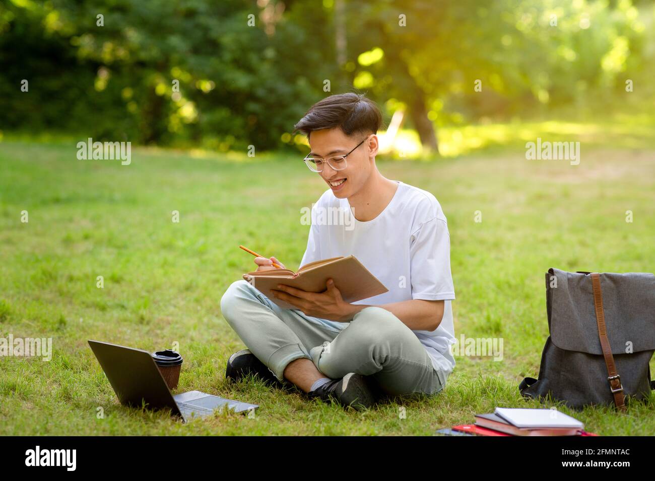 Male student book pen hi-res stock photography and images - Alamy