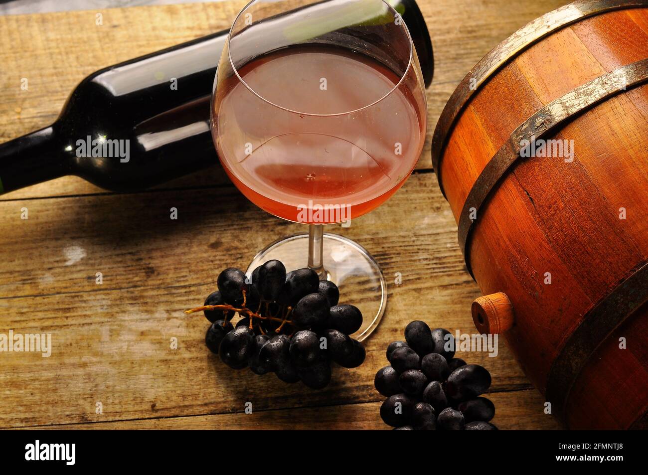 Glass and bottle of wine on a studio shot Stock Photo - Alamy