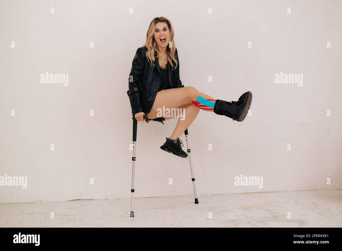 Young beautiful woman broke her leg, accident. Rehabilitation with ...