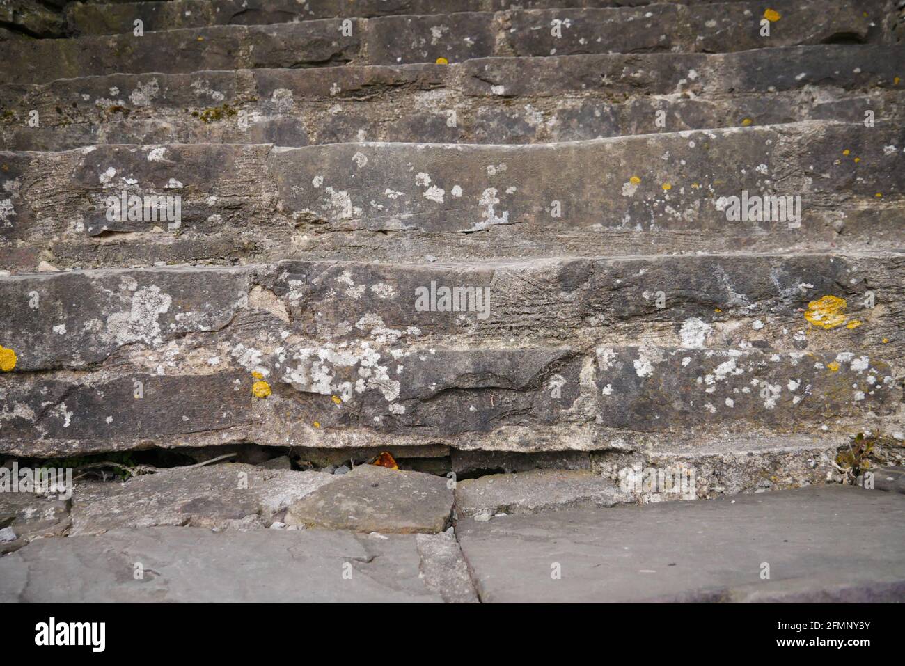 close up of an old medieval stone staircase on large stone blocks as a ...