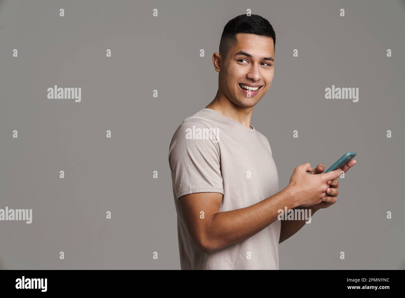 Handsome guy using mobile hi-res stock photography and images - Alamy