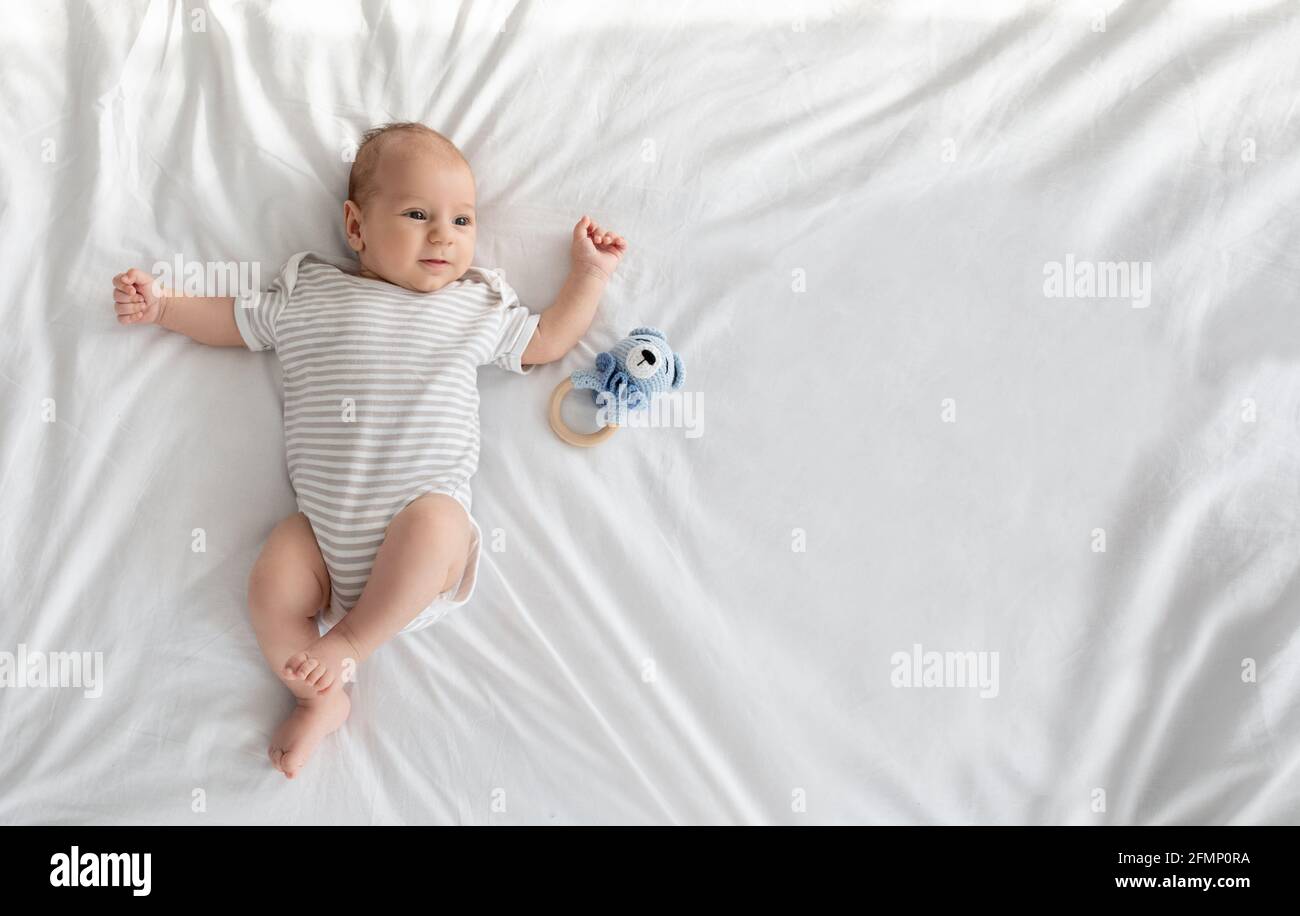 Child Care Concept. Top View Of Adorable Newborn Baby Lying On Bed ...