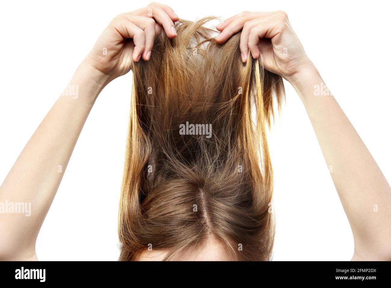 The girl raised her hair on a white background Stock Photo - Alamy