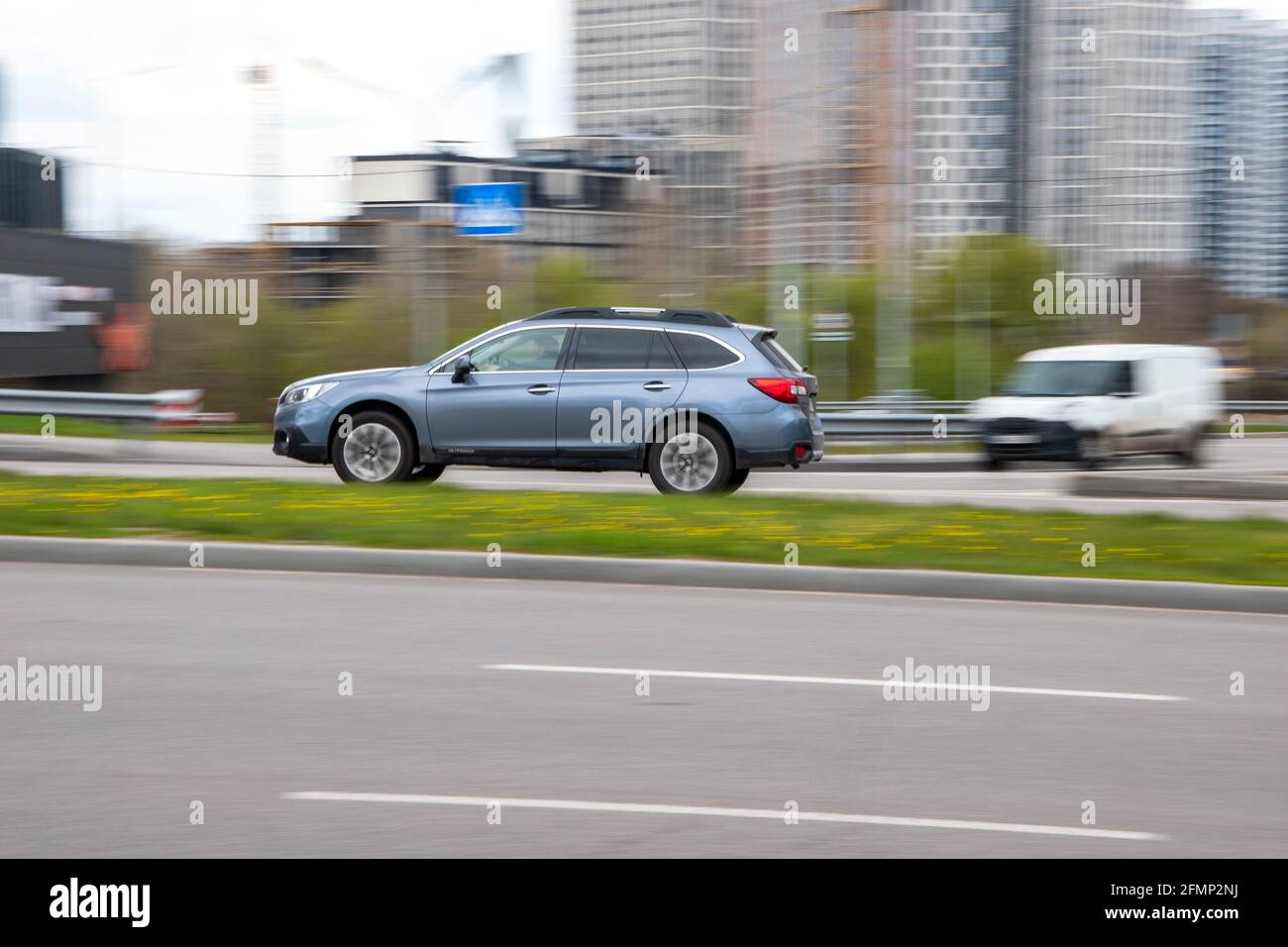 Ukraine, Kyiv - 26 April 2021: Light Blue Subaru Outback car moving on ...