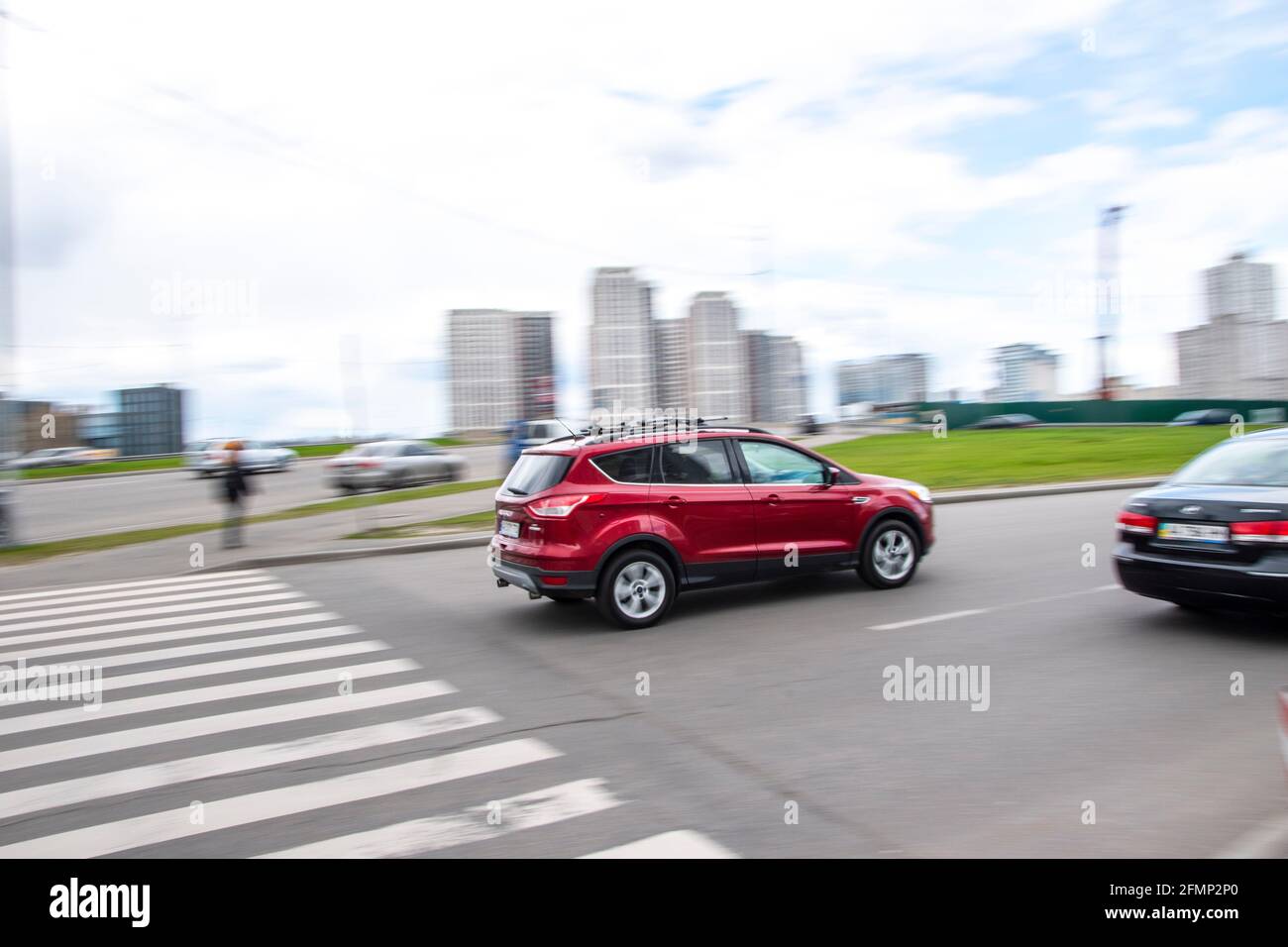 Ukraine, Kyiv - 26 April 2021: Purple Ford Escape car moving on the ...