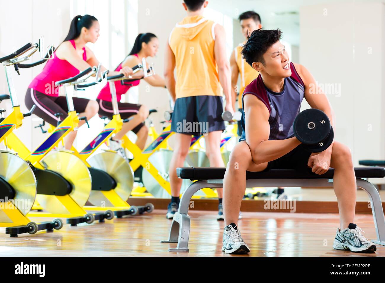 Chinese Asian group of men and woman doing sport exercise or training ...