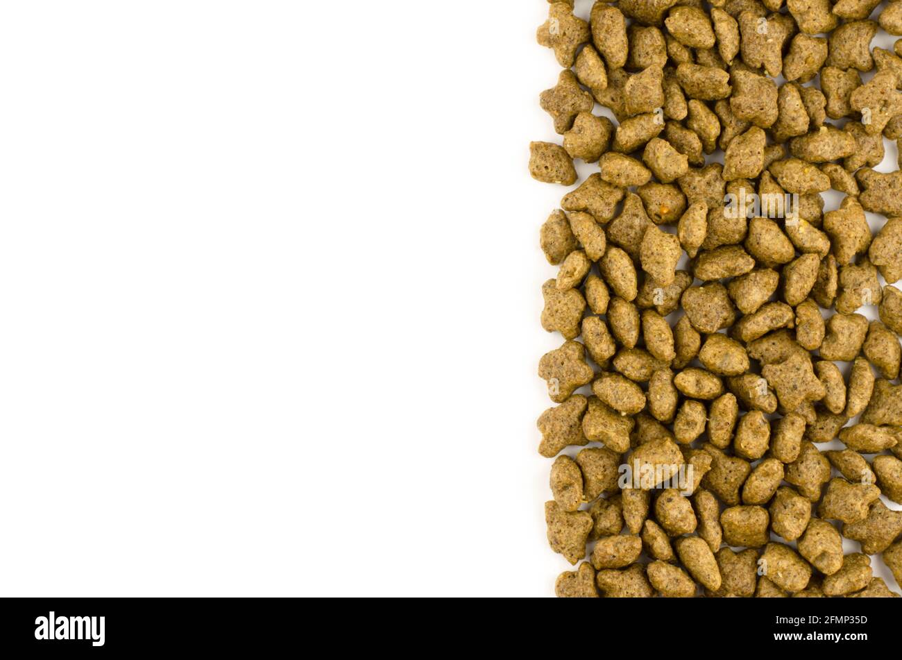 Dry cat food on white background with place for text Stock Photo - Alamy