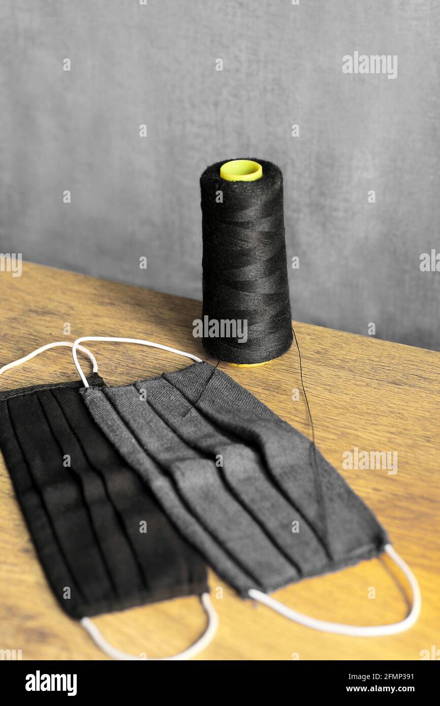 Medical masks. Masks against the virus. Stitched masks and spool of ...