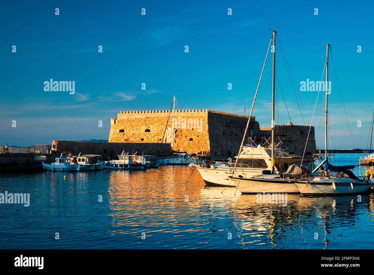 Venetian Fort in Heraklion and moored fishing boats, Crete Island ...