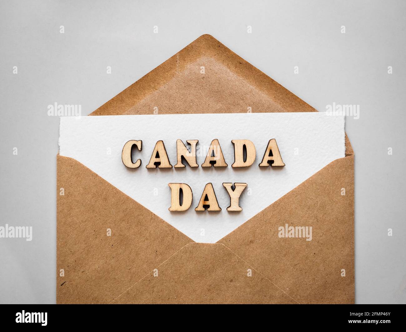 Happy Canadian Day. Postal envelope painted in the national colors of ...