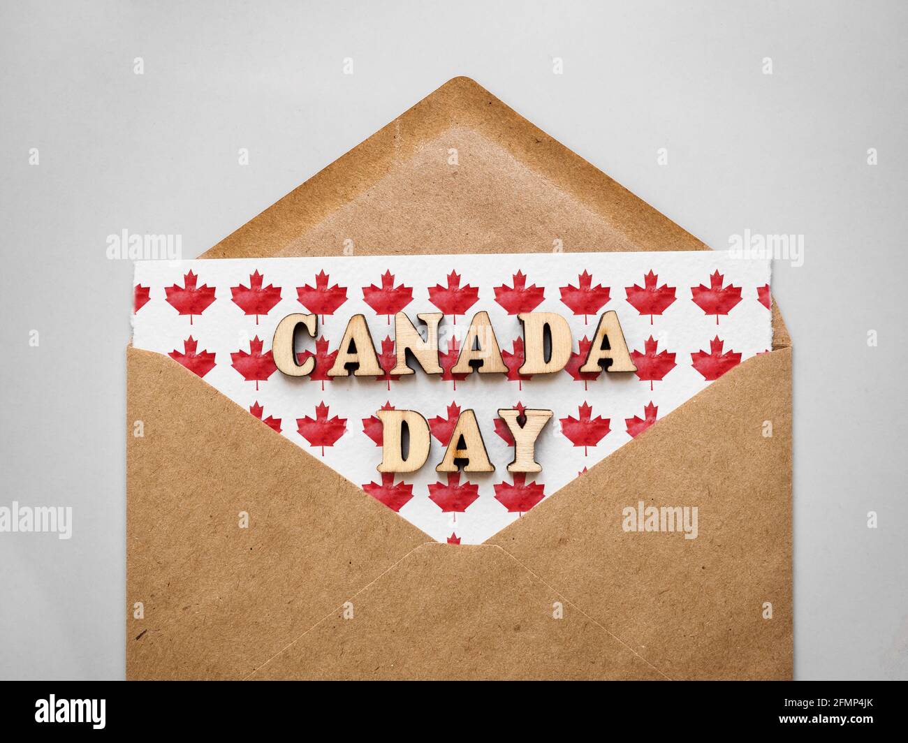 Happy Canadian Day. Postal envelope painted in the national colors of ...