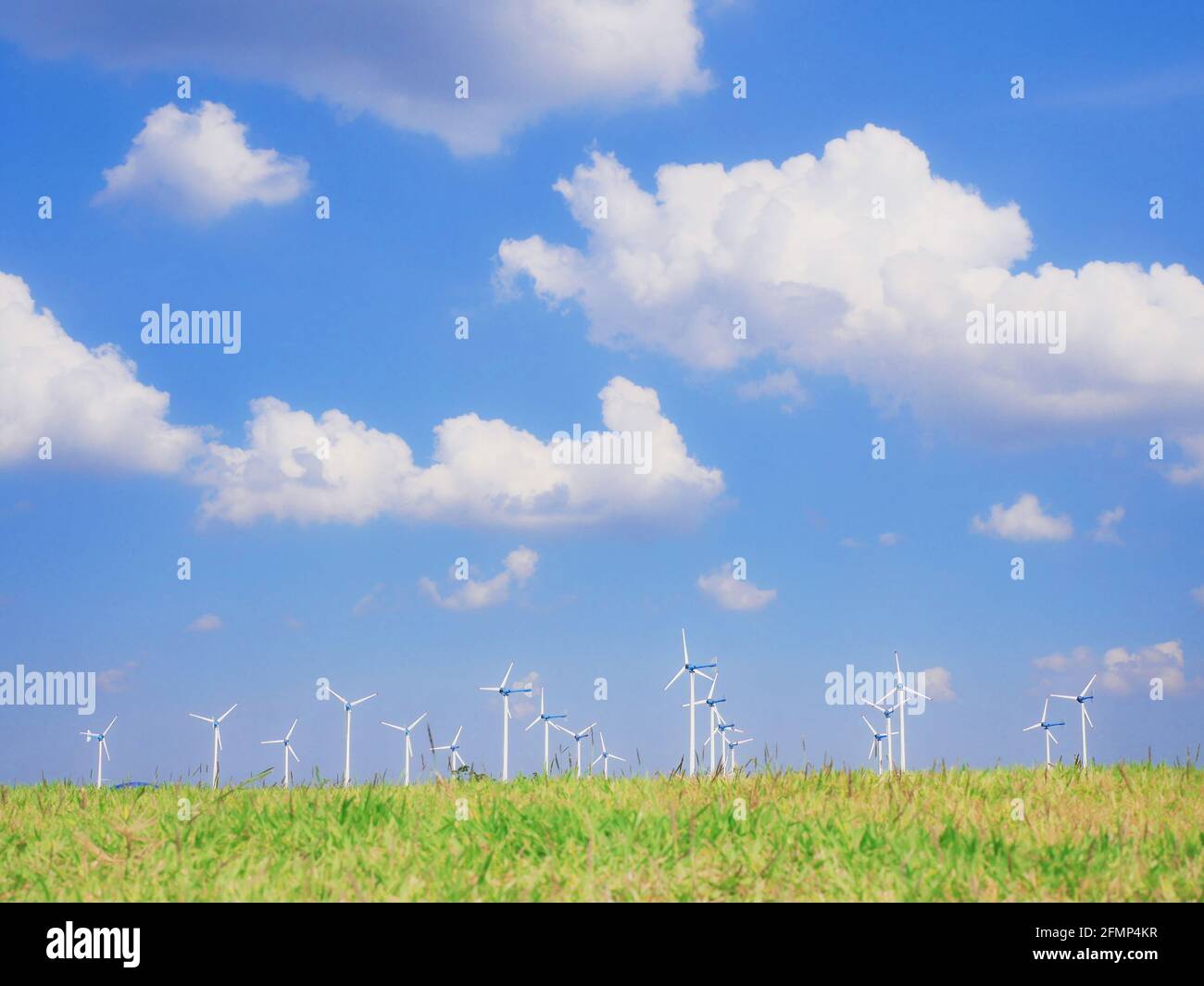 Photo of a field of wind turbine generating electricity from a distance ...