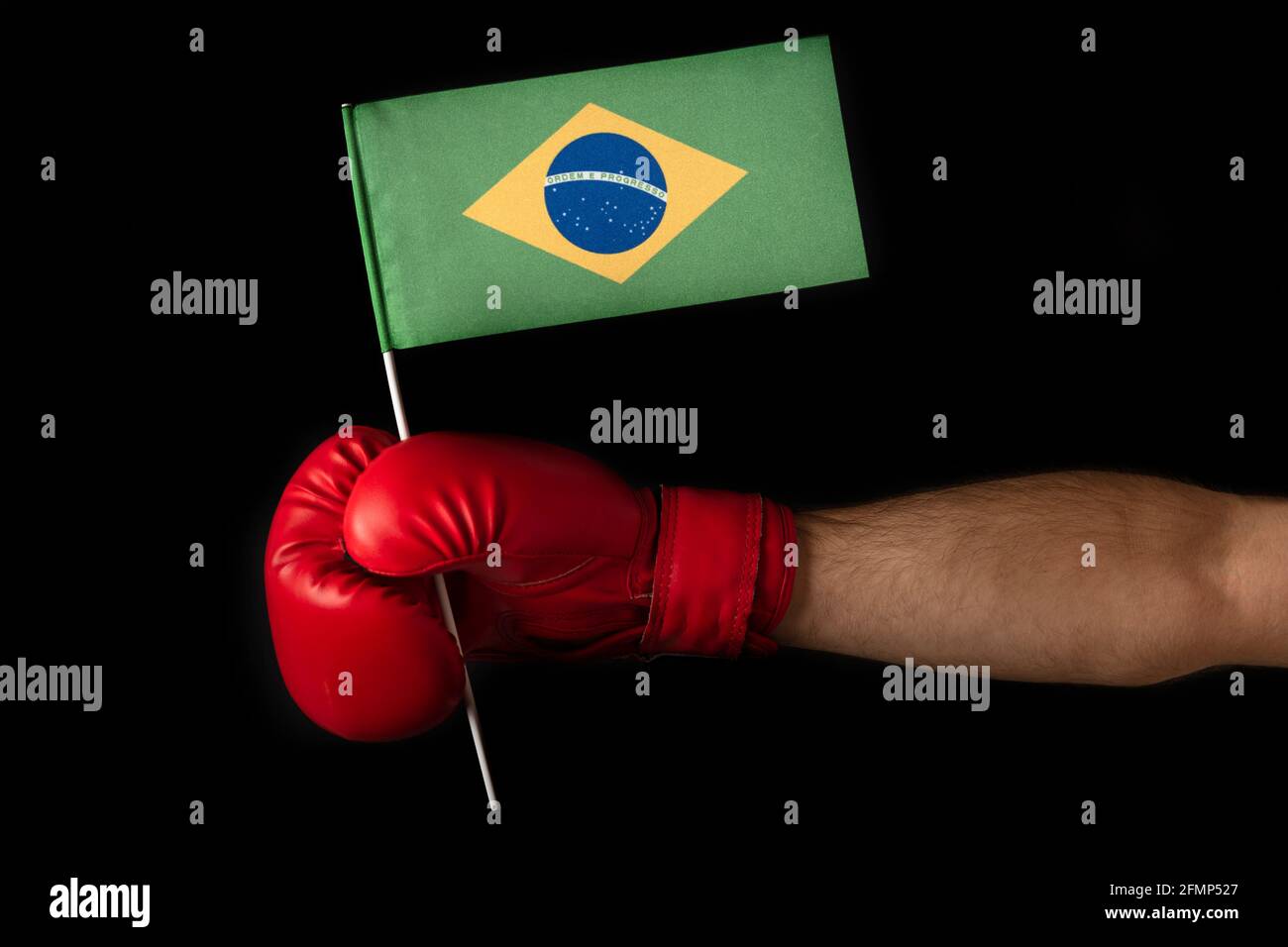 Boxer hand holds flag of Brazil. Boxing glove with the Brazilian flag ...