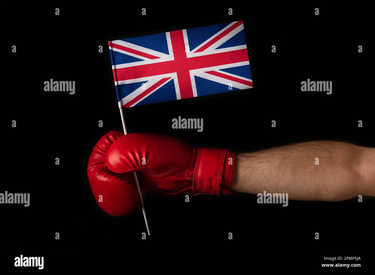 Boxer hand holds flag of Great Britain. Boxing glove with the Great ...
