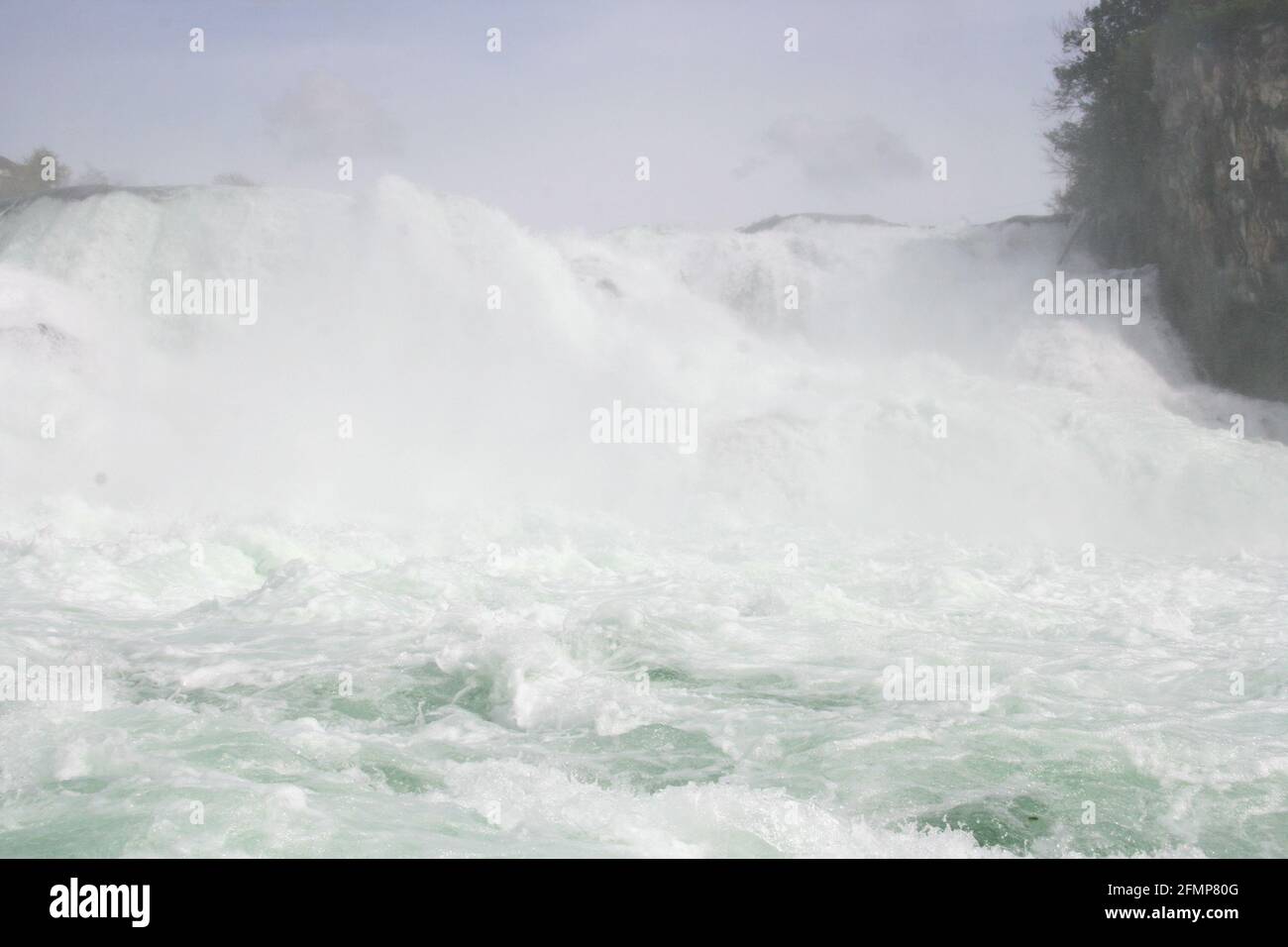 a waterfall with white, foaming in spray Stock Photo - Alamy
