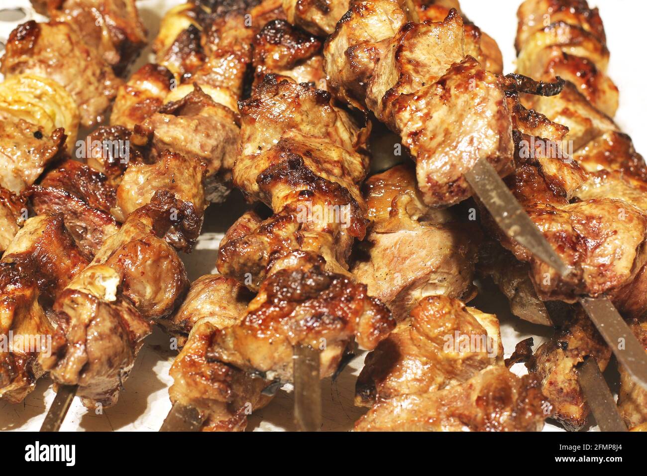 Grilled kebab. Roasted meat with onions. Background from food. Pork ...