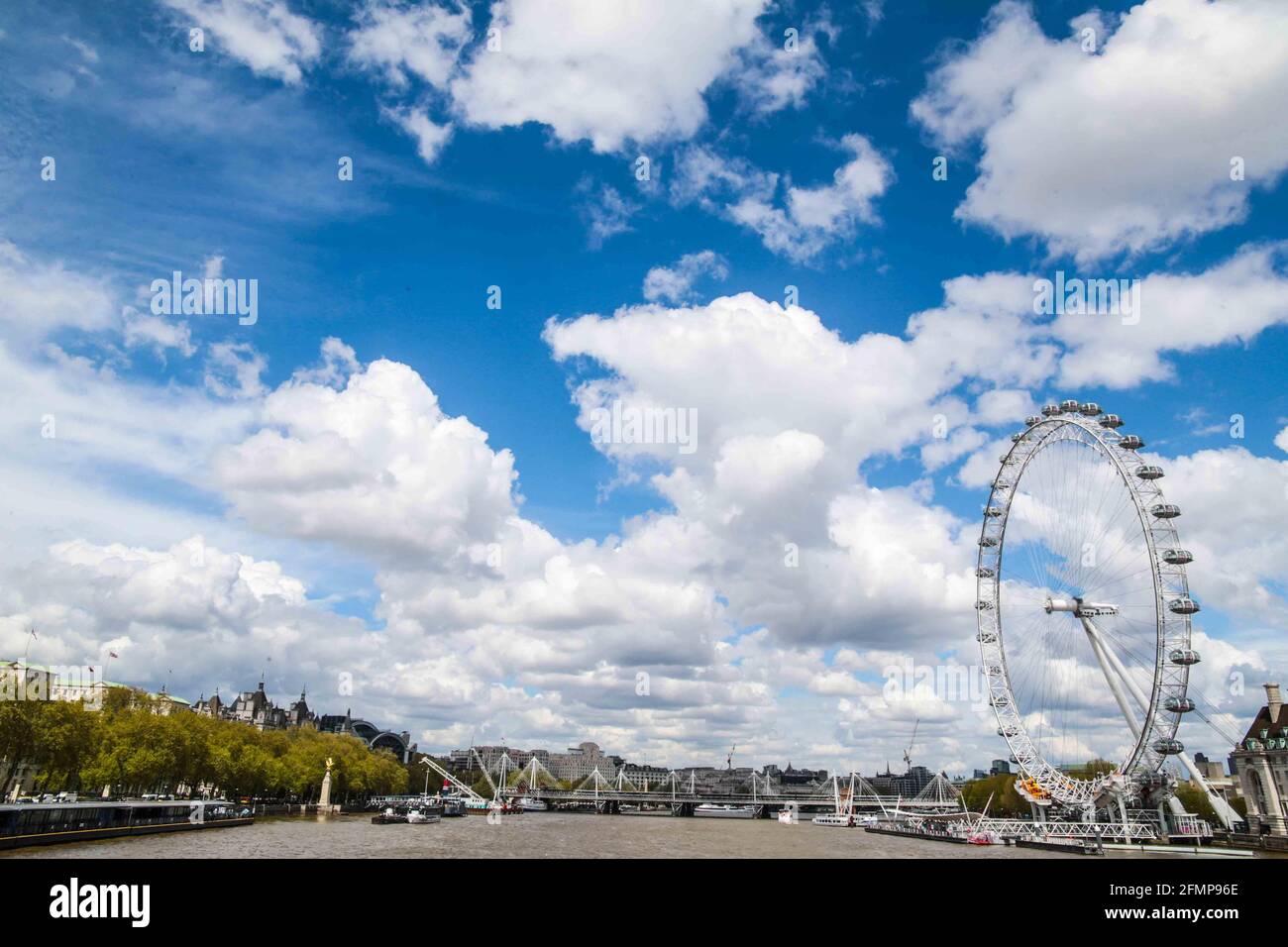 London eye among white clouds hi-res stock photography and images - Alamy