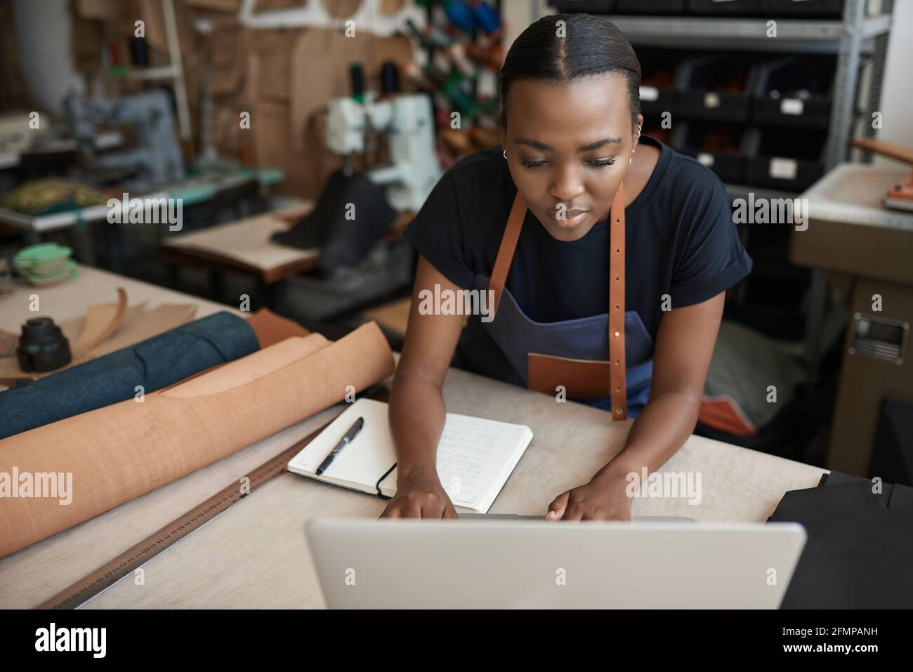 African american tailor using fabric hi-res stock photography and ...