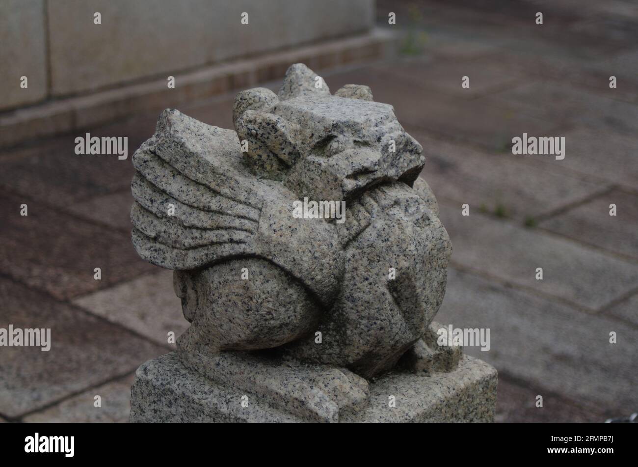 Carved stone animal outside dendoin temple Stock Photo - Alamy