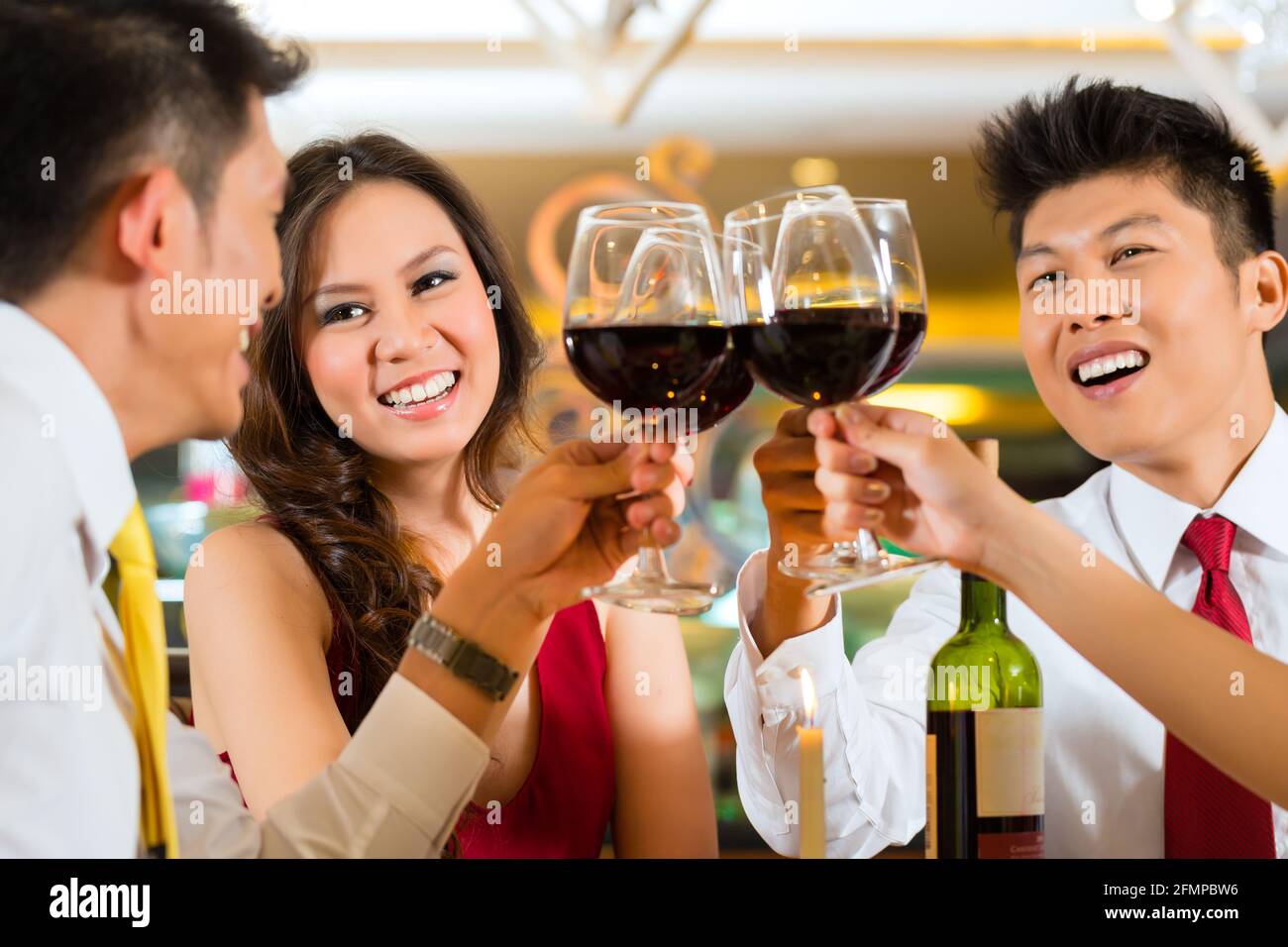Two Asian Chinese Couples or friends or business people toasting during ...