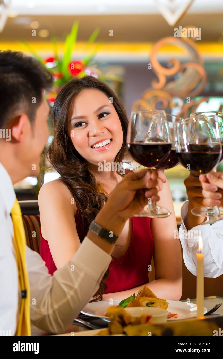Couple toasting in chinese restaurant hi-res stock photography and ...