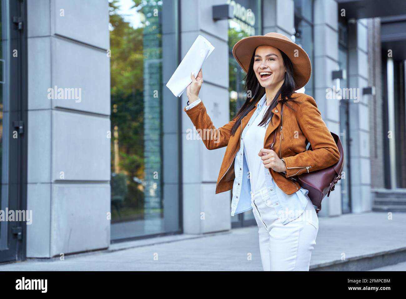 Smiling female traveler using map hi-res stock photography and images ...