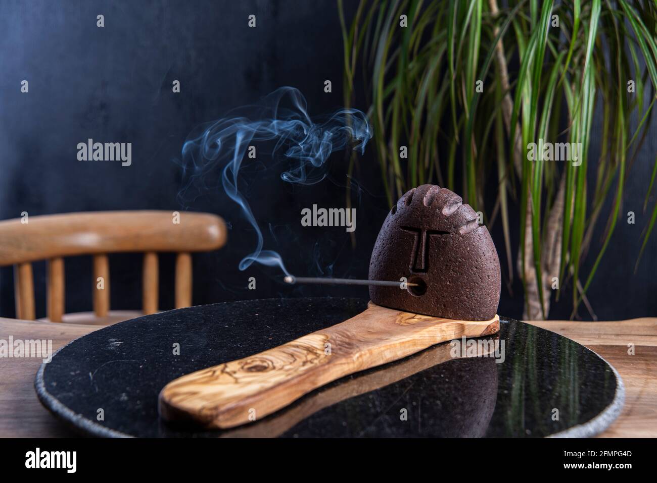 incense with smoke on design holder Stock Photo - Alamy