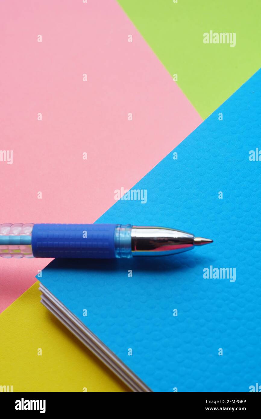 Blue ballpoint pen on different paper colors Stock Photo - Alamy