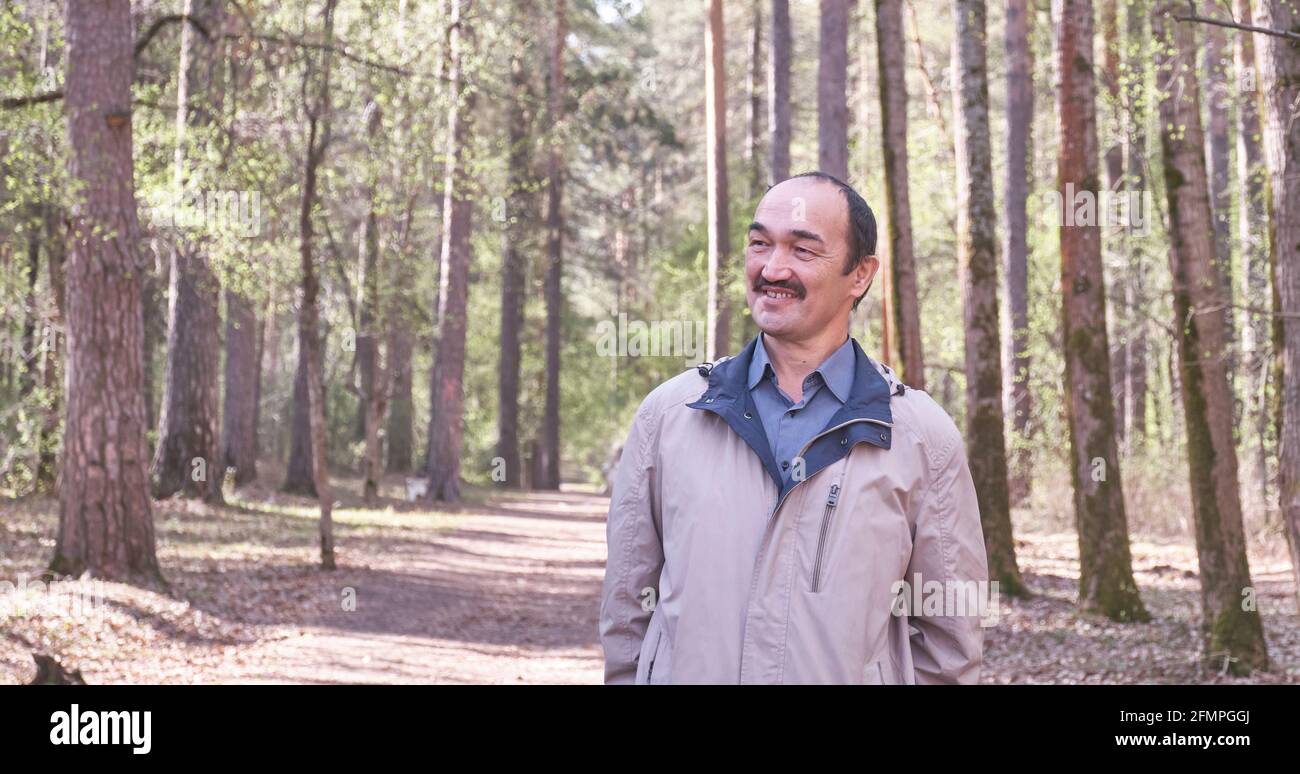 Portrait smiling man in forest hi-res stock photography and images - Alamy