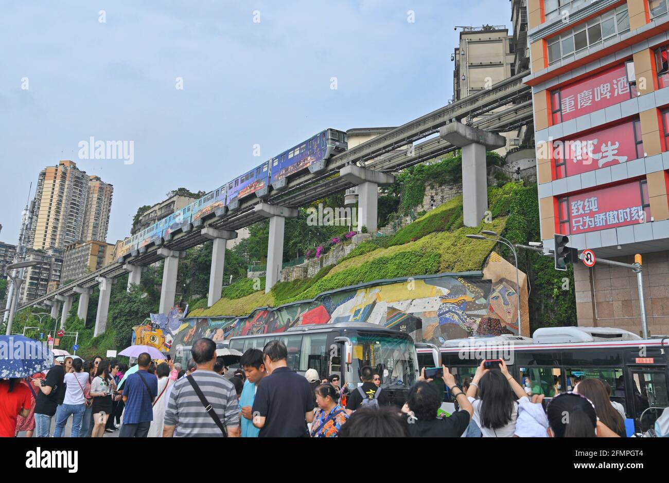 CHONGQING, CHINA - MAY 10, 2021 - Tourists watch or photograph the ...