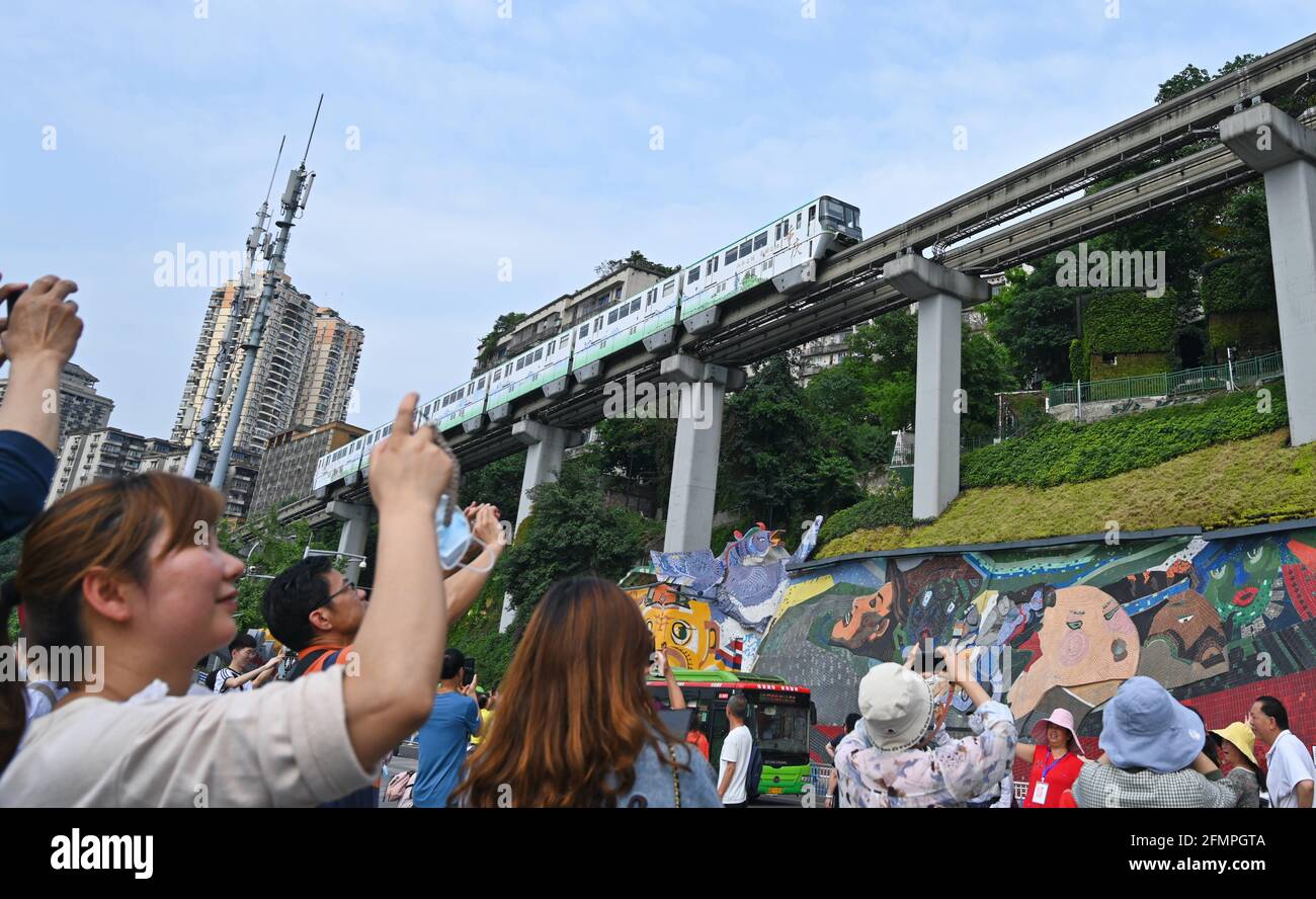 CHONGQING, CHINA - MAY 10, 2021 - Tourists watch or photograph the ...
