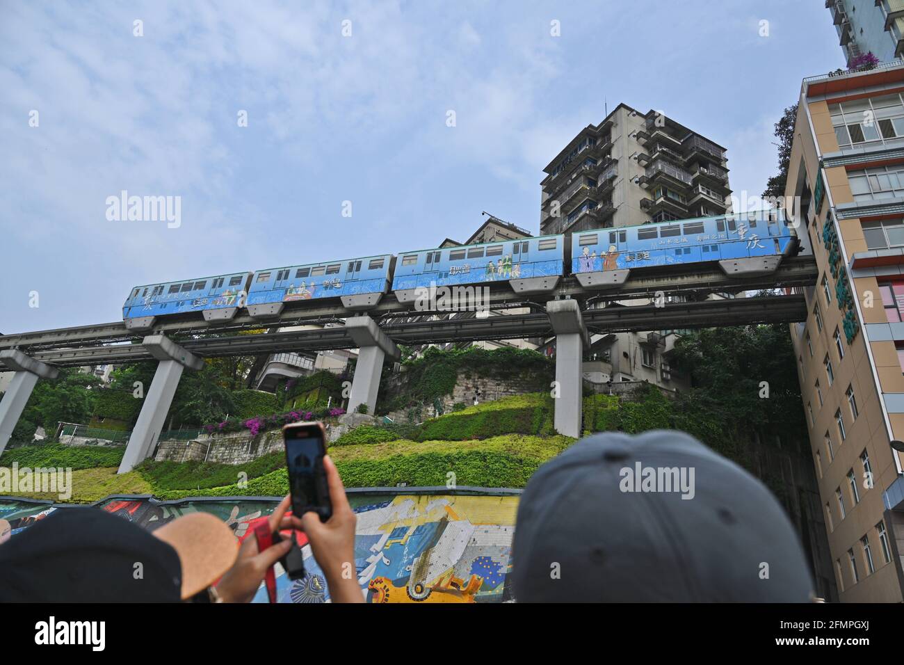 CHONGQING, CHINA - MAY 10, 2021 - Tourists watch or photograph the ...