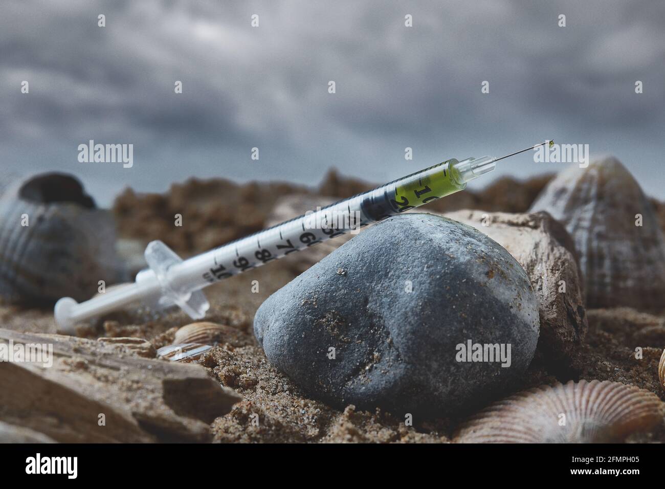 Injection needle on the beach Stock Photo - Alamy