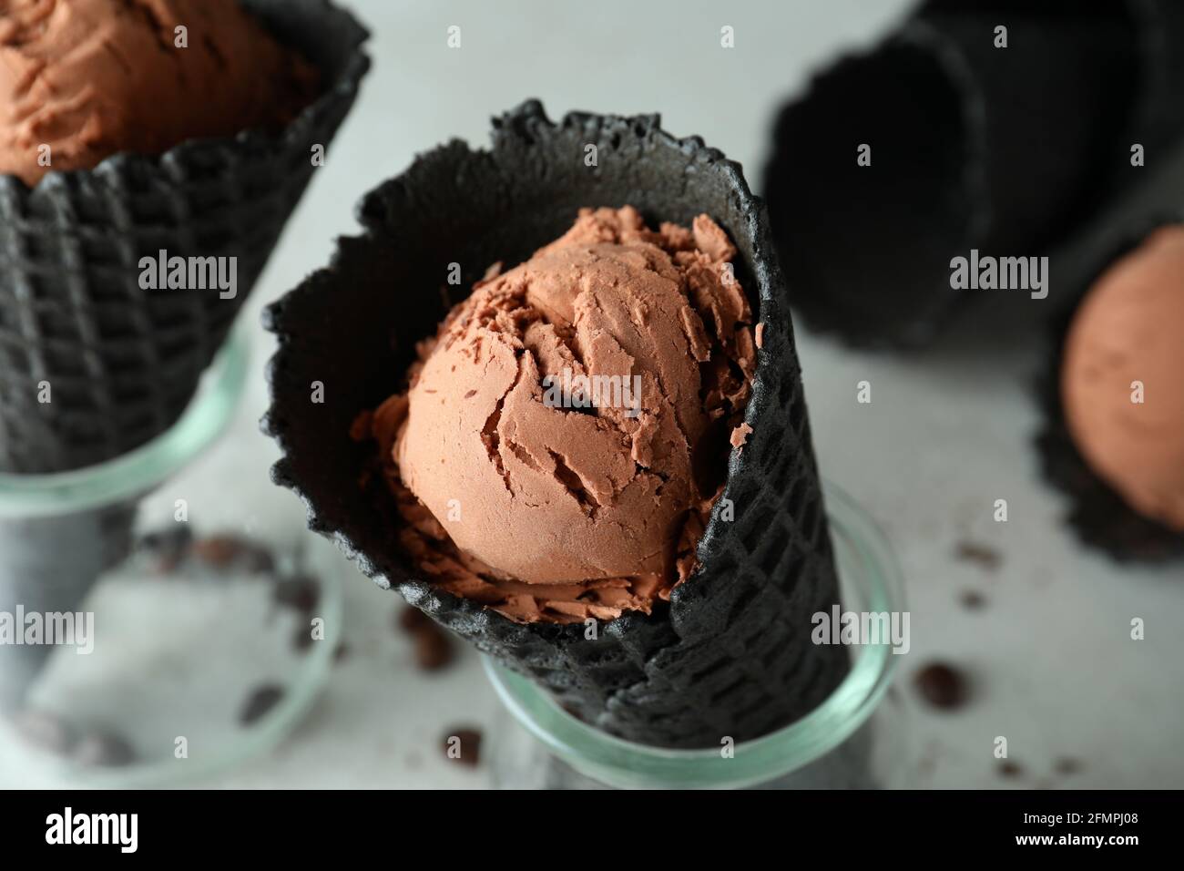 Black cones with ice cream, close up Stock Photo - Alamy