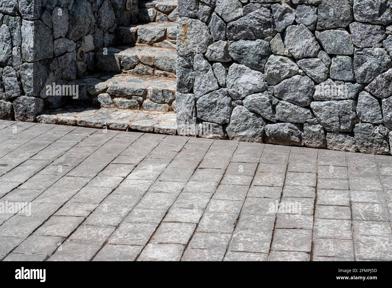Gray granite stone wall and granite staircase in the park Stock Photo - Alamy