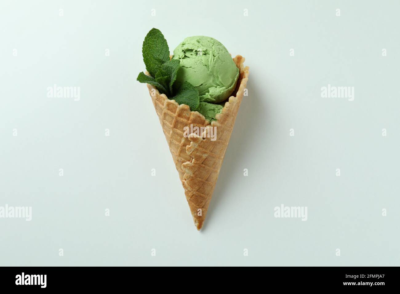Cone of mint ice cream on white background Stock Photo - Alamy