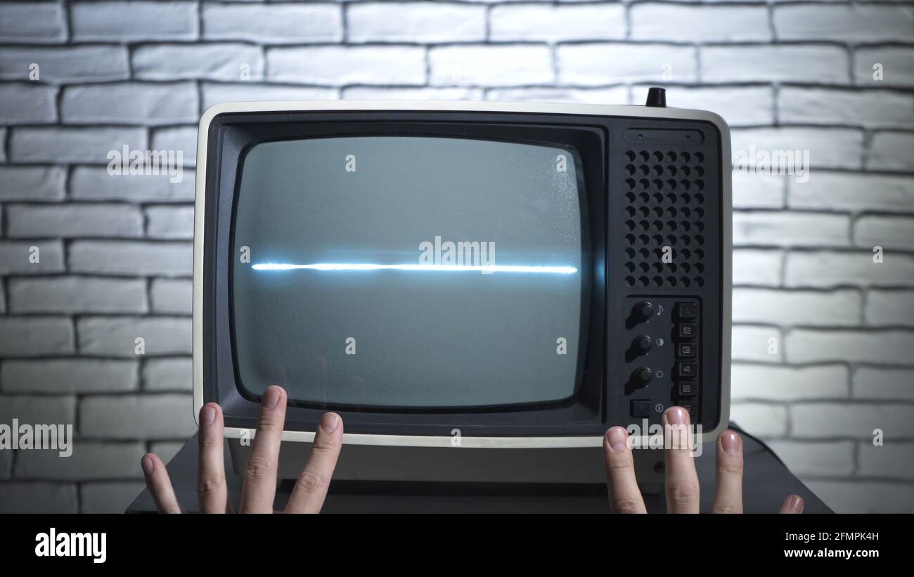 Photo of retro tv and human's hands Stock Photo - Alamy