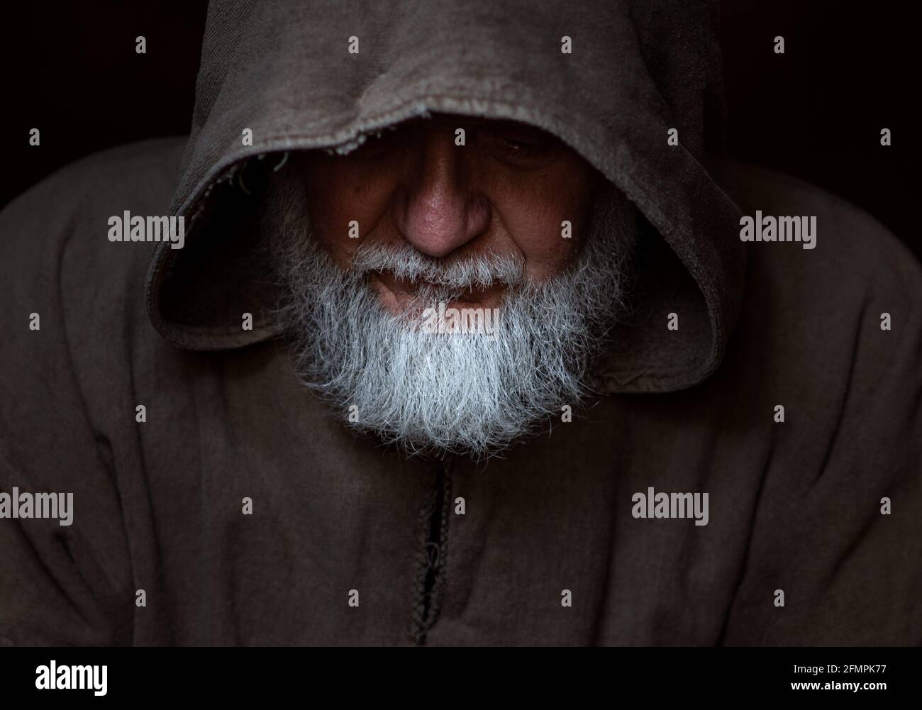 Medieval face of a poor beggar or monk Stock Photo - Alamy