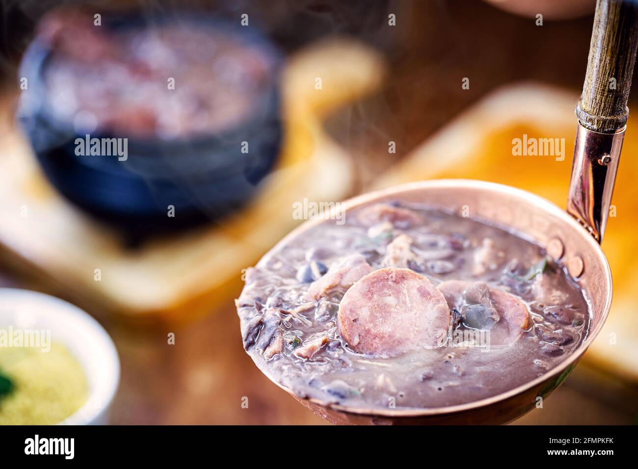 Beans and pork, Brazilian food. Pork with beans, sausage, cabbage and ...