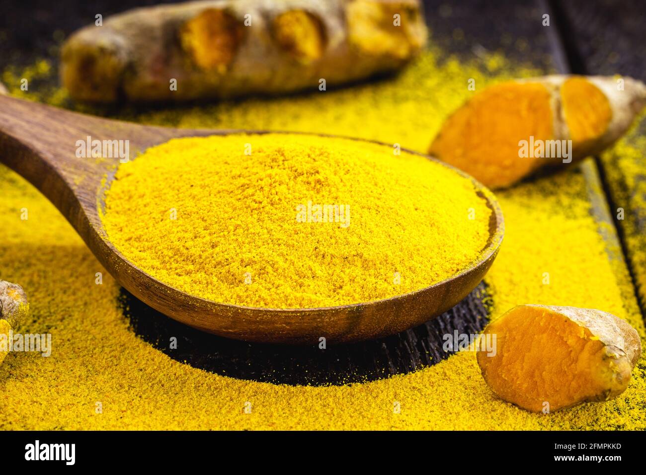 spoonful of turmeric powder, culinary seasoning, also known as turmeric ...